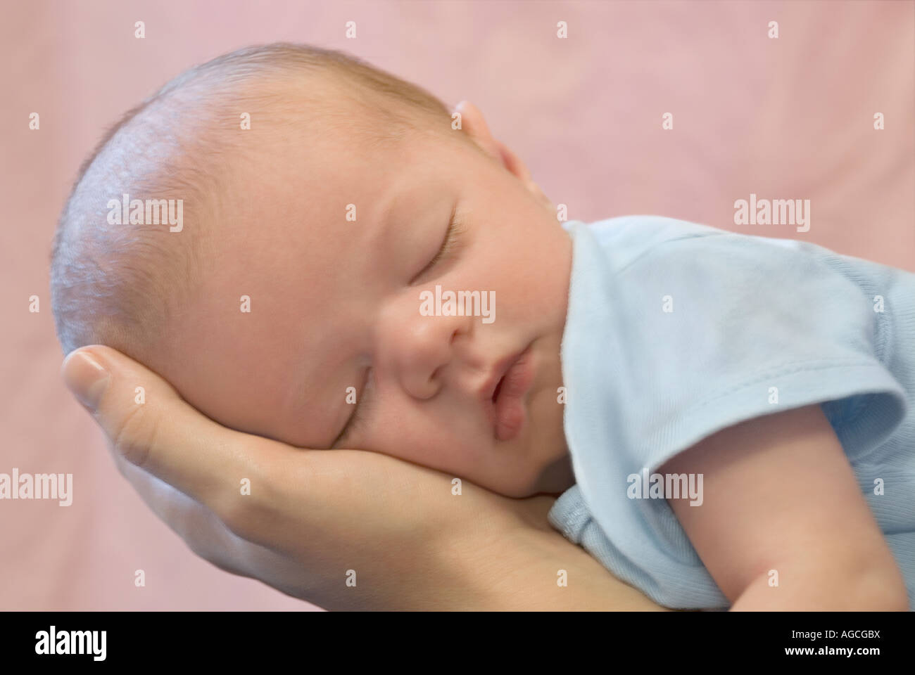 Sleeping baby mothers hand hi-res stock photography and images - Alamy