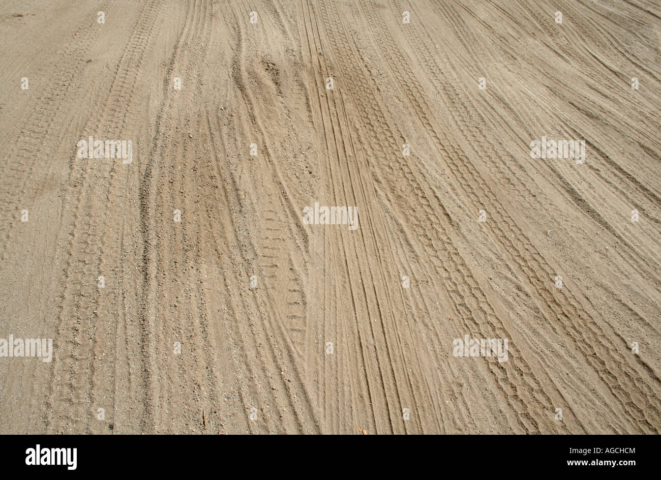 Tire car or truck tracks in beige colored dirt and sand Stock Photo - Alamy