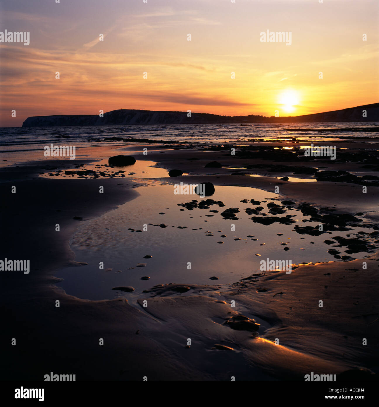 Sunset over Compton Bay Stock Photo - Alamy