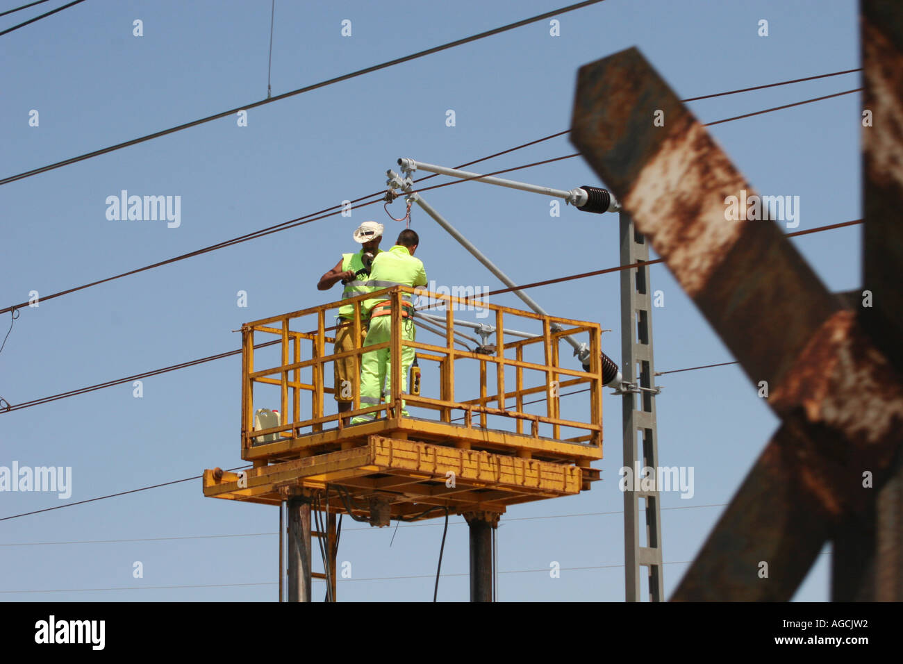 Rail workers fixing cable Stock Photo - Alamy