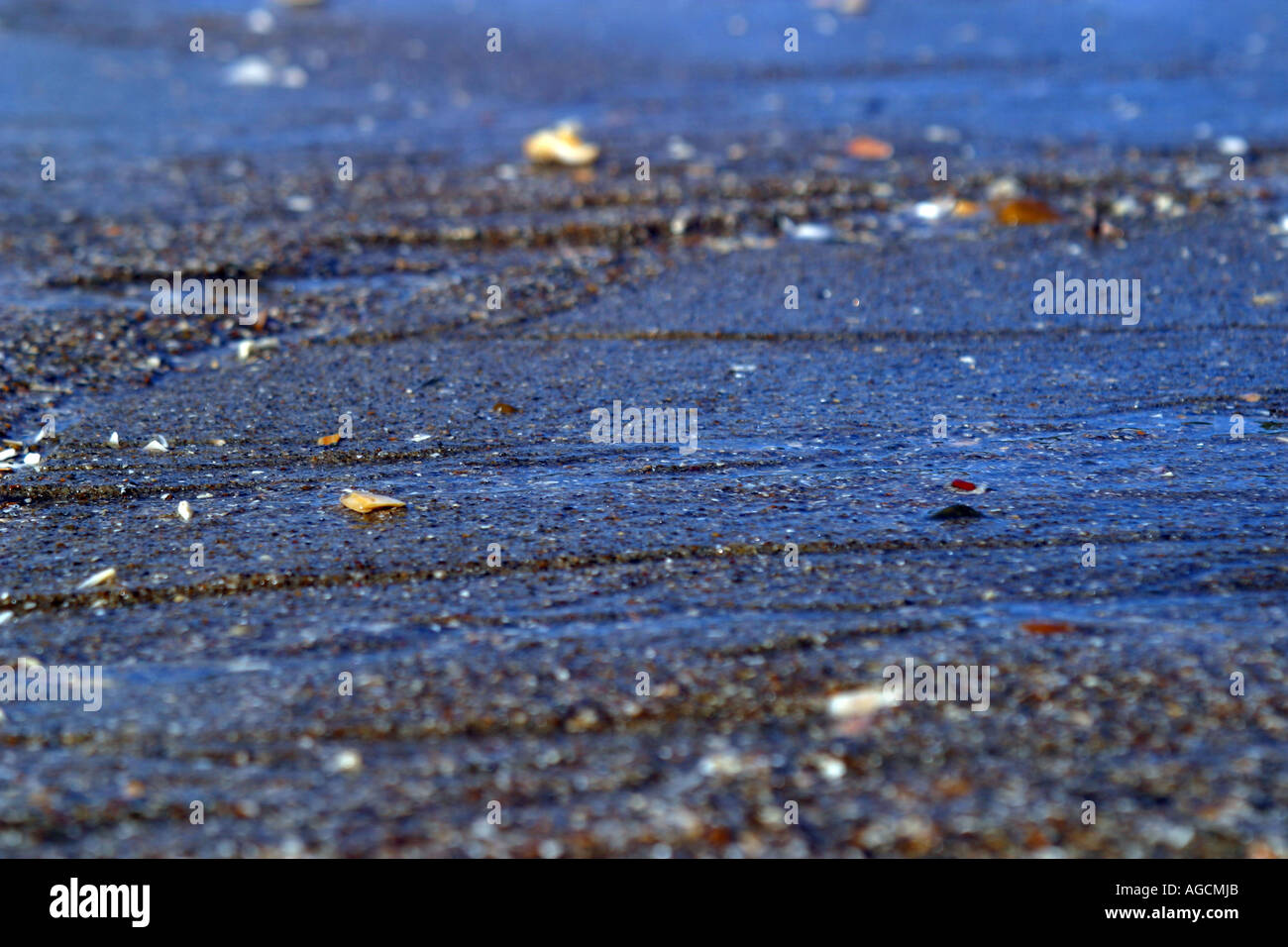 Sky reflection in water on the beach Stock Photo - Alamy