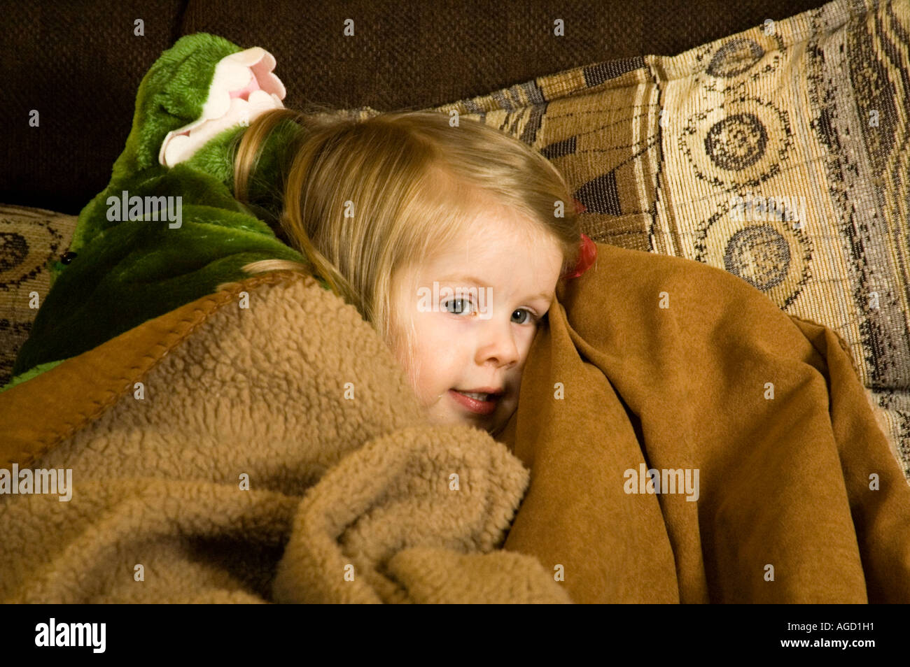 Little girl snuggled down for her afternoon nap Stock Photo - Alamy
