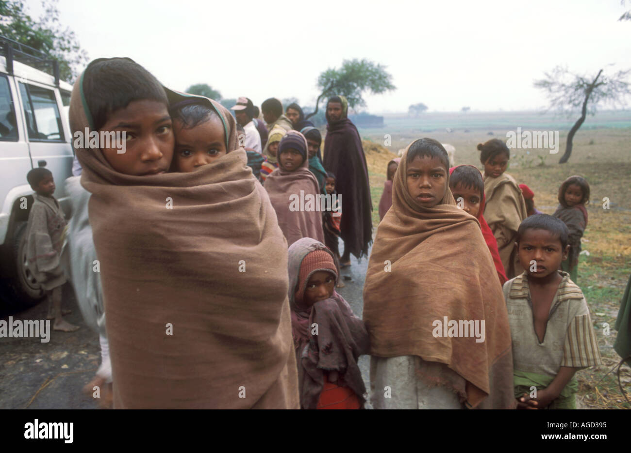 Poor village children surrounding a broken down car in Bihar India ...