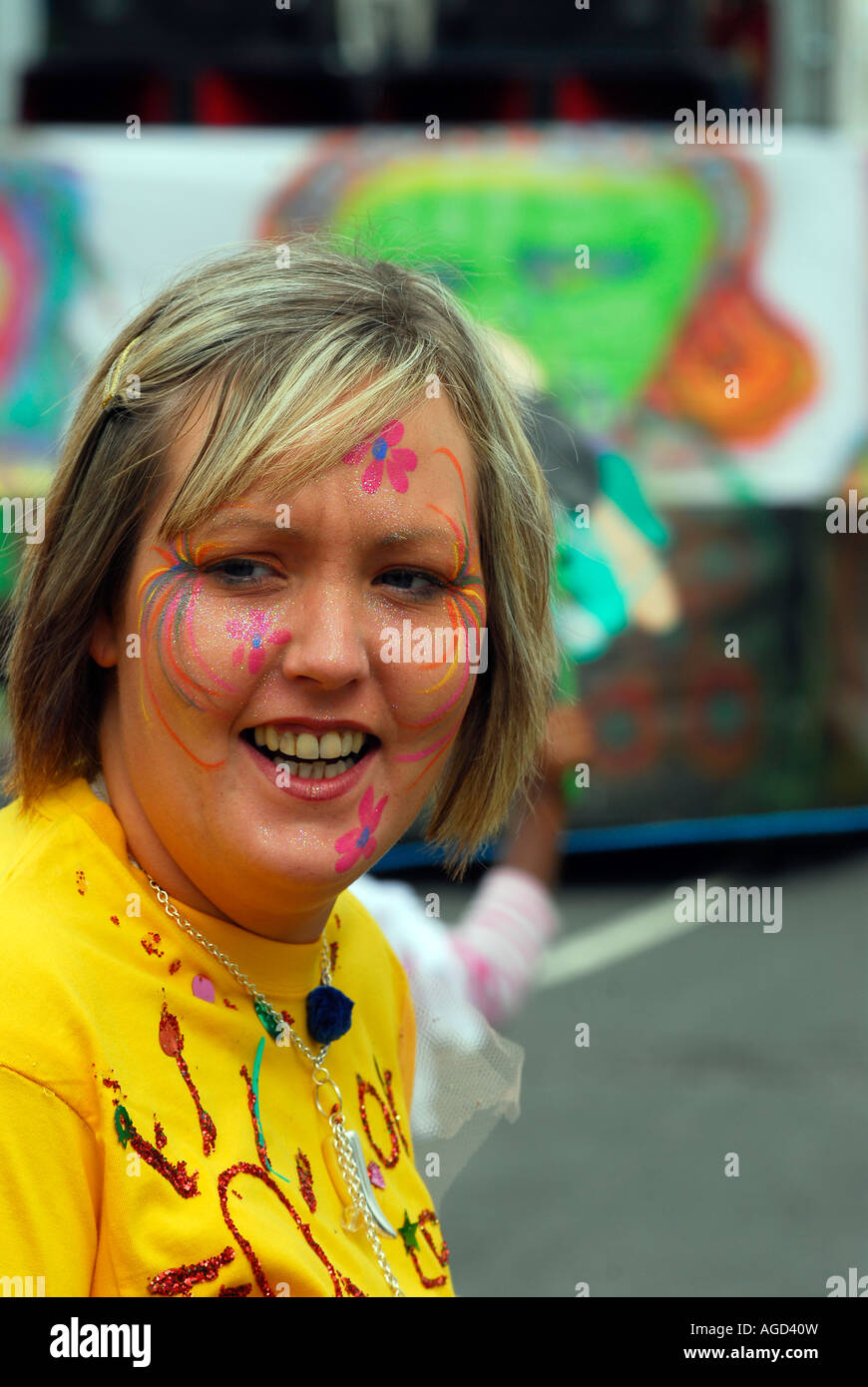Woman with her face painted at a carnival procession in Hounslow ...