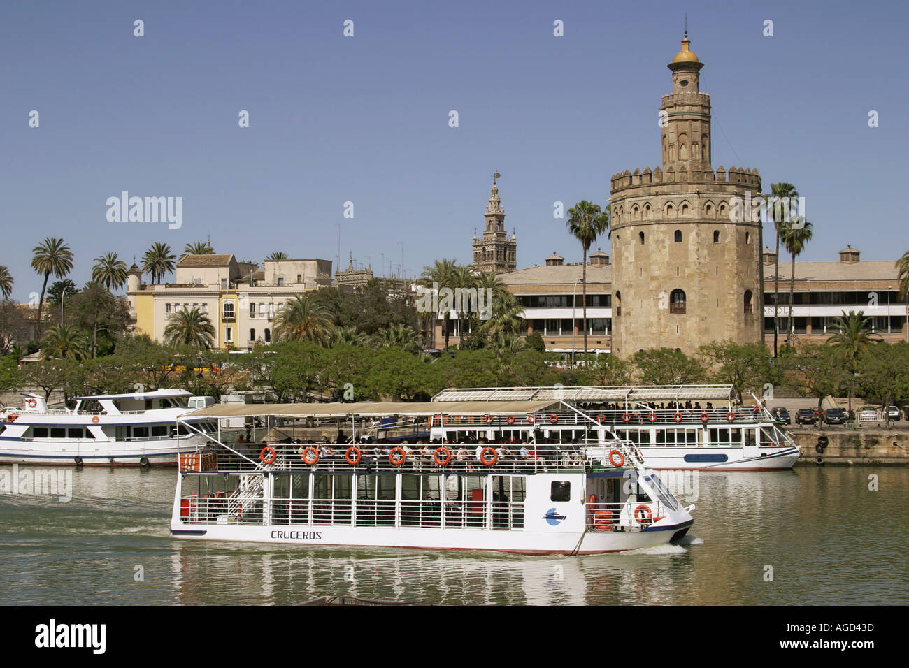 Seville Spain Tour boat in front of Torre del Oro La Giralda tower ...