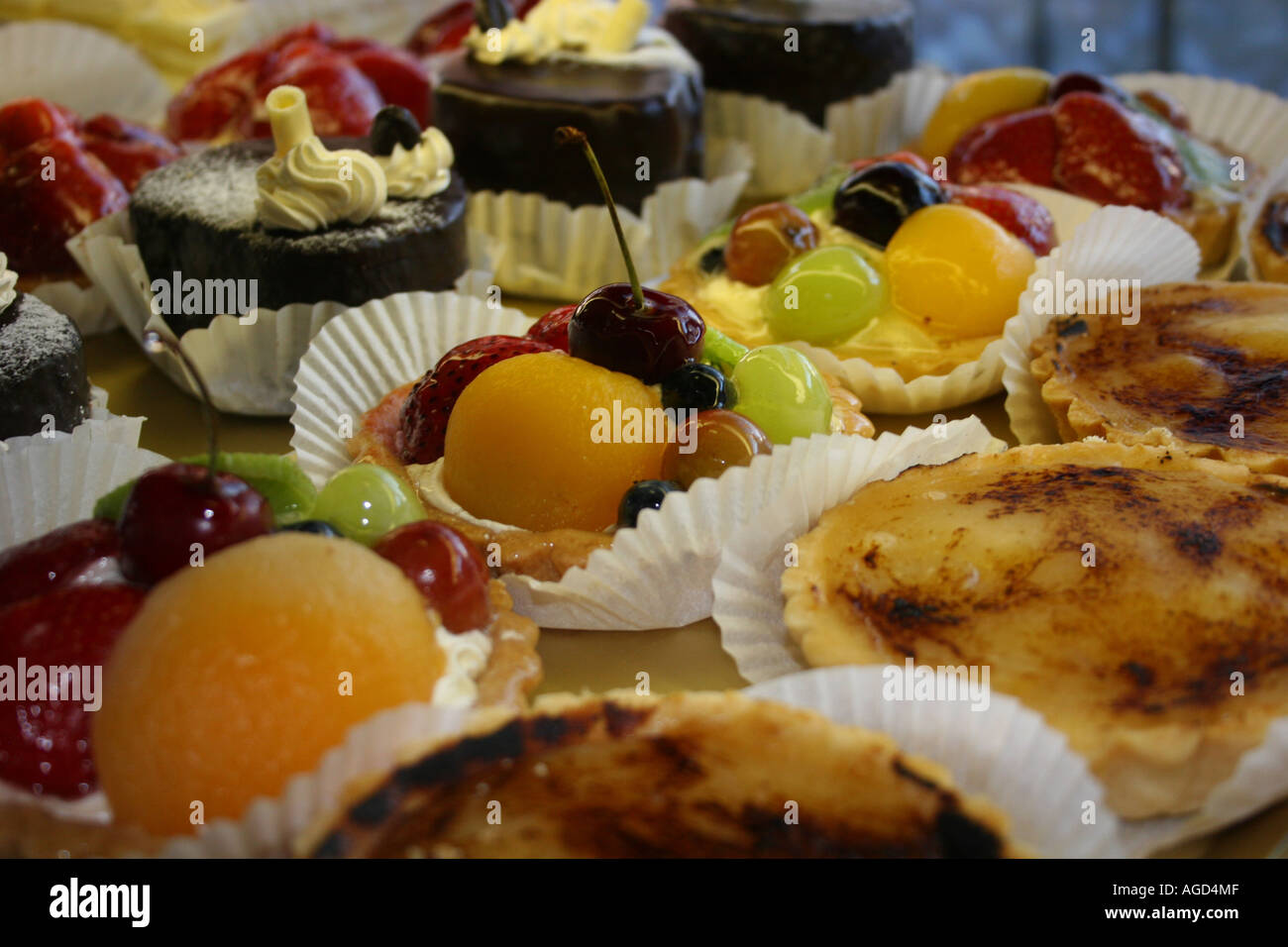 row of colourful cakes Stock Photo - Alamy
