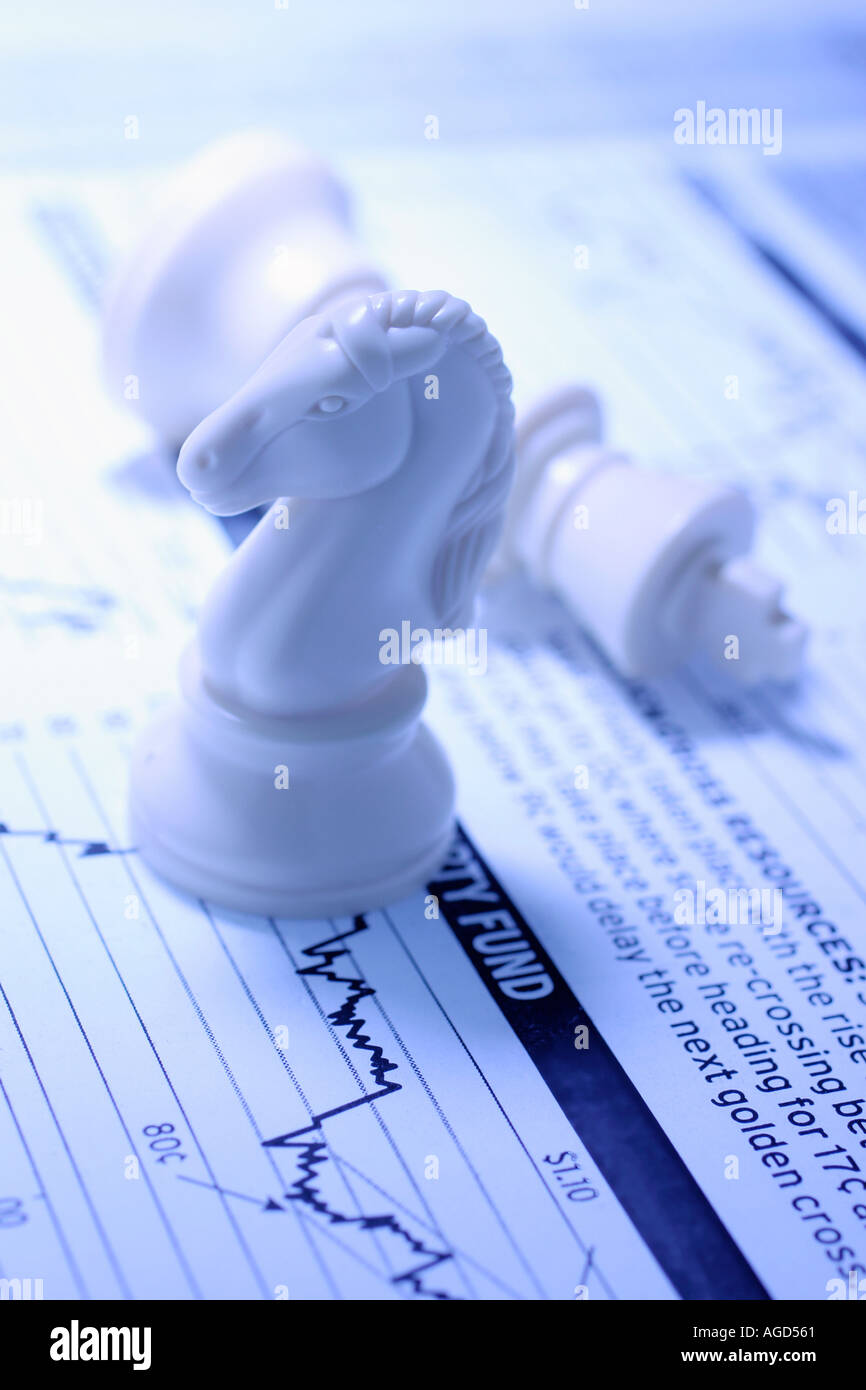 Chess Pieces on Financial Newspaper Stock Photo - Alamy