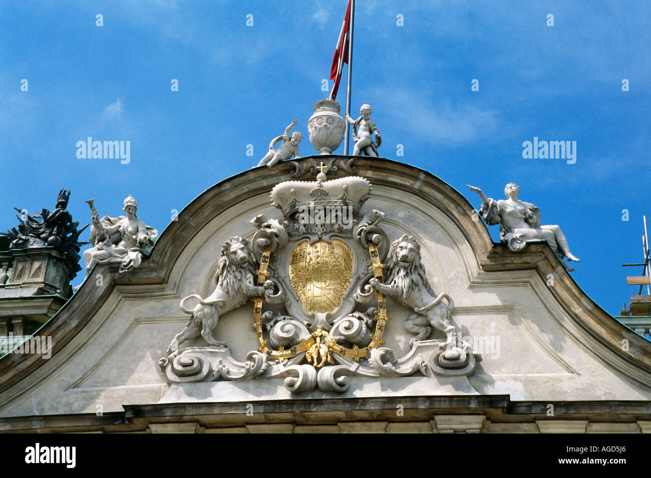 Detail of gilded stone coat of arms two lions on either side a crown ...