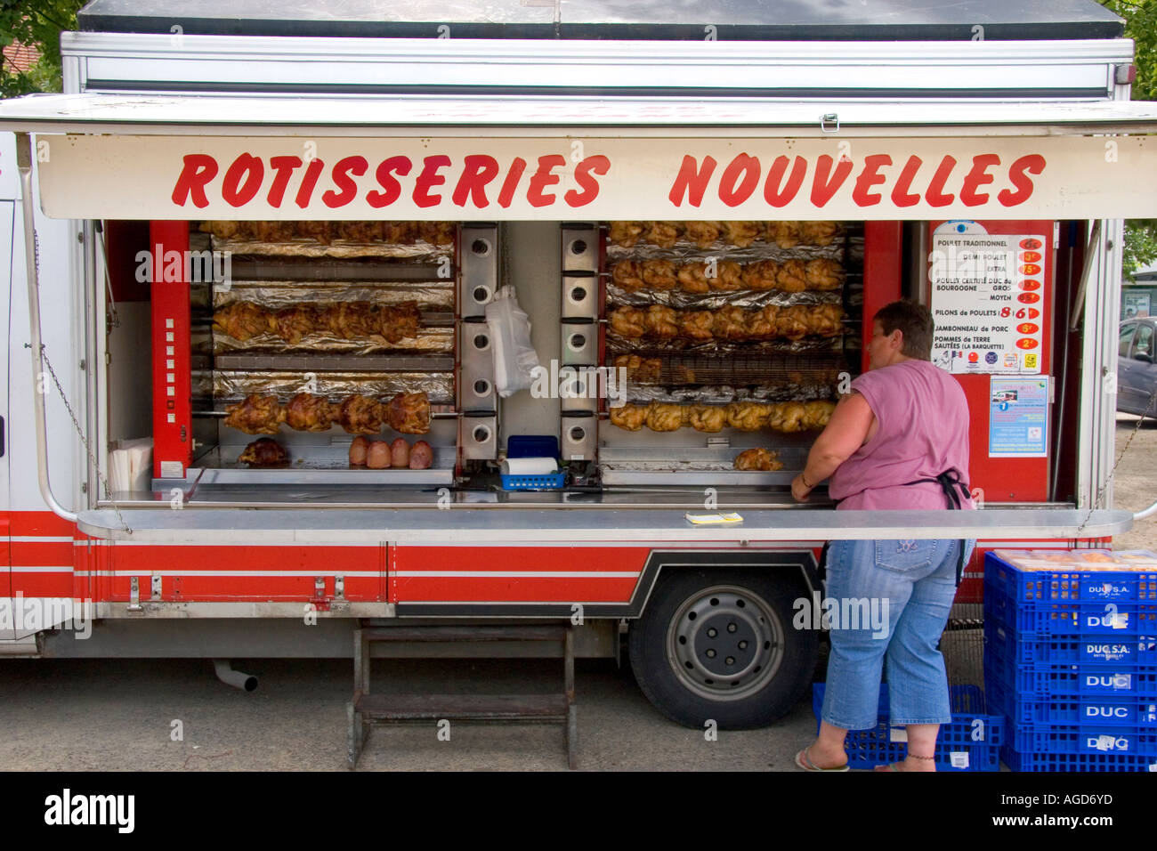 Rotisserie chicken being sold at an open air market in Neuf-Brisach ...