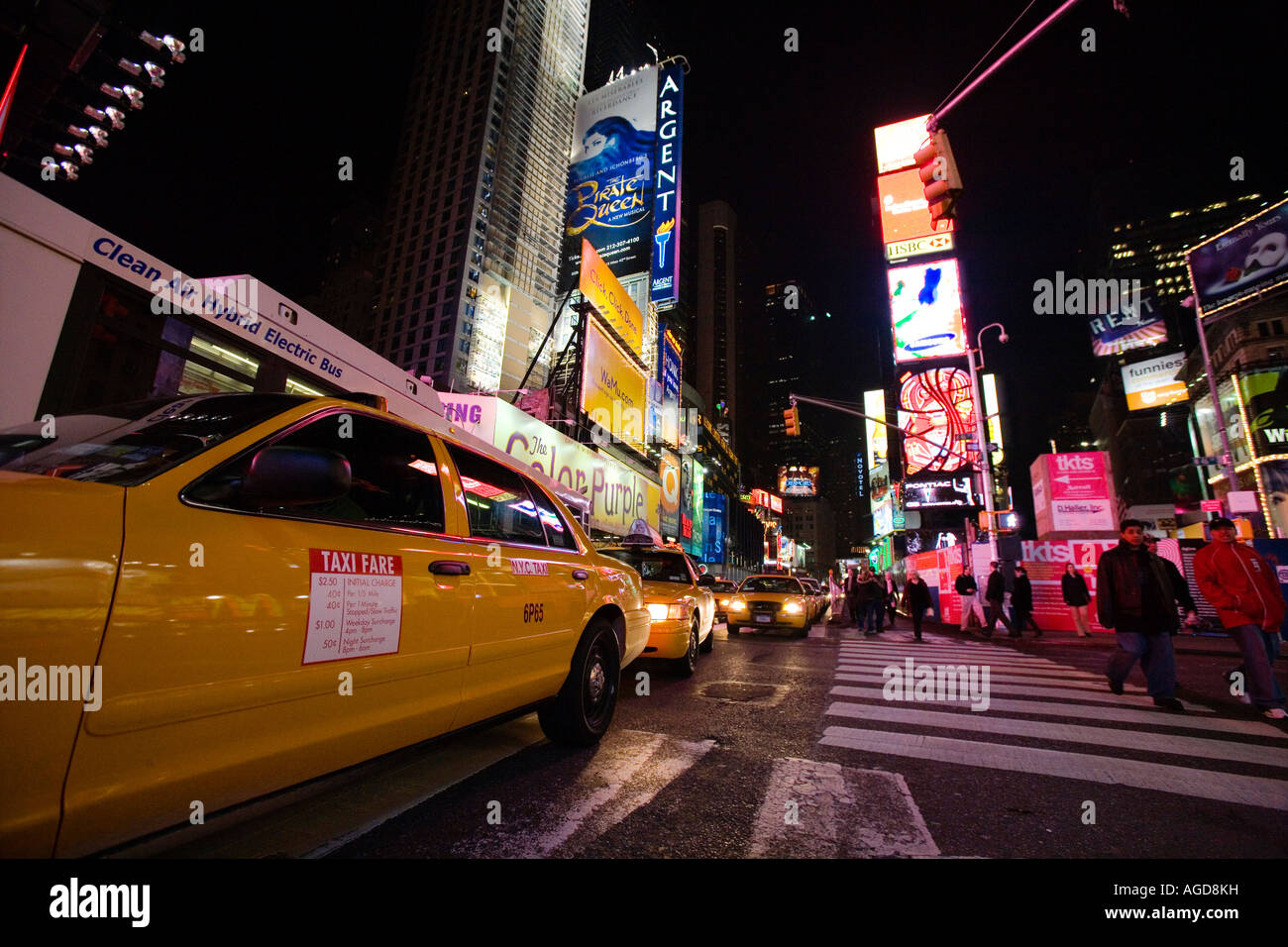 Times Square street scene New York City at night Stock Photo - Alamy