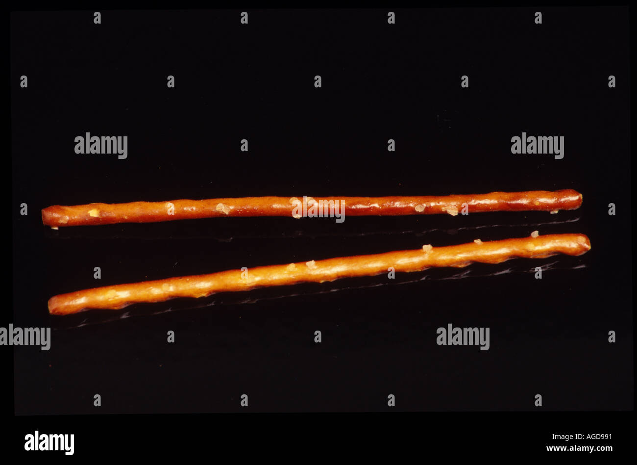 Food snacks salt sticks two single sticks on black ground Stock Photo ...