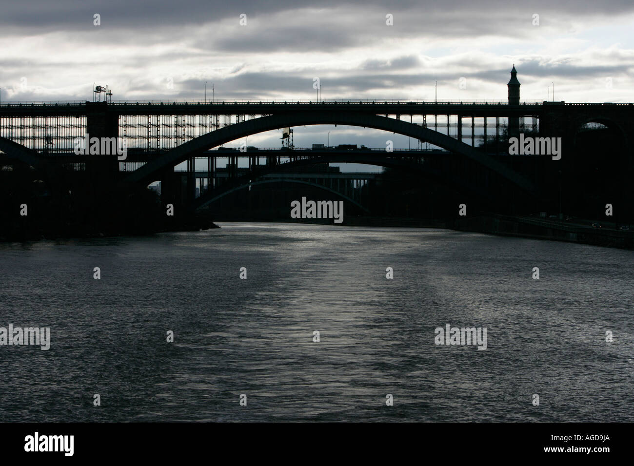 silhouette in evening light of washington heights bridge alexander ...