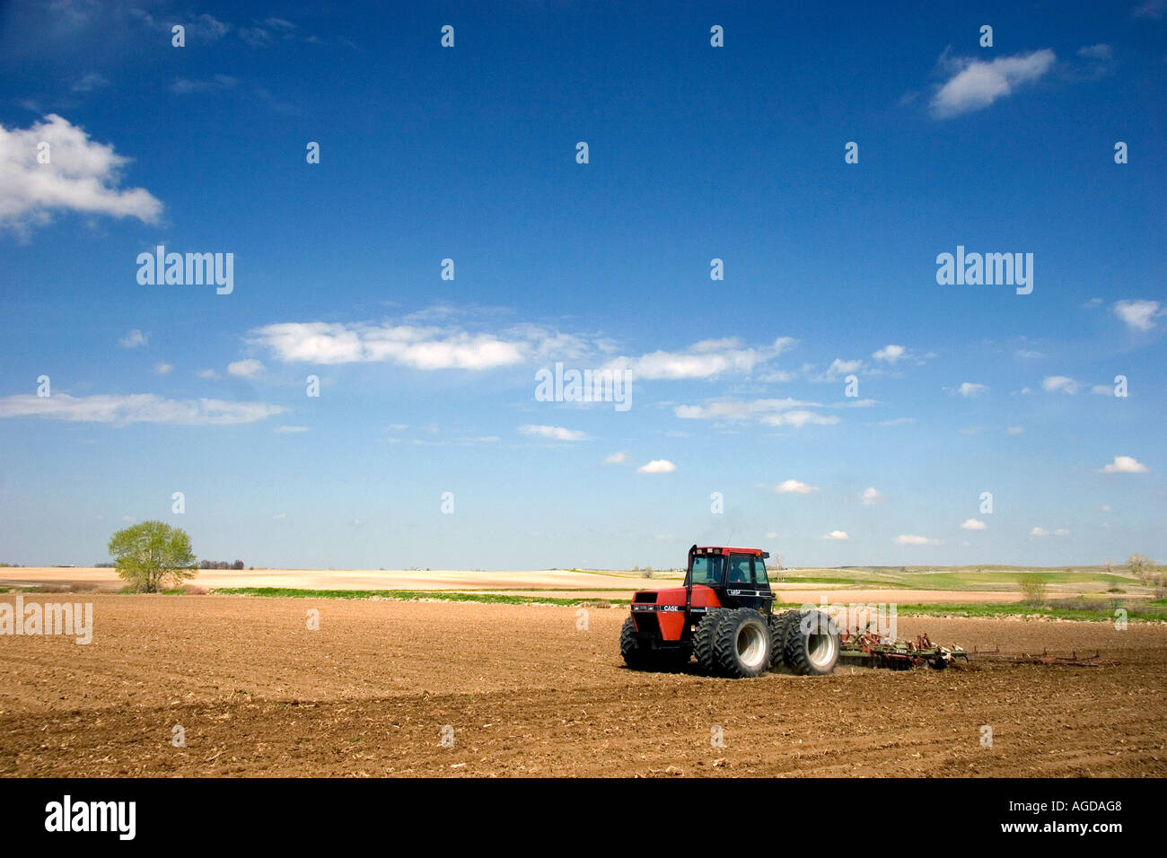 A tractor spring tilling a crop in Canyon County, Idaho Stock Photo - Alamy