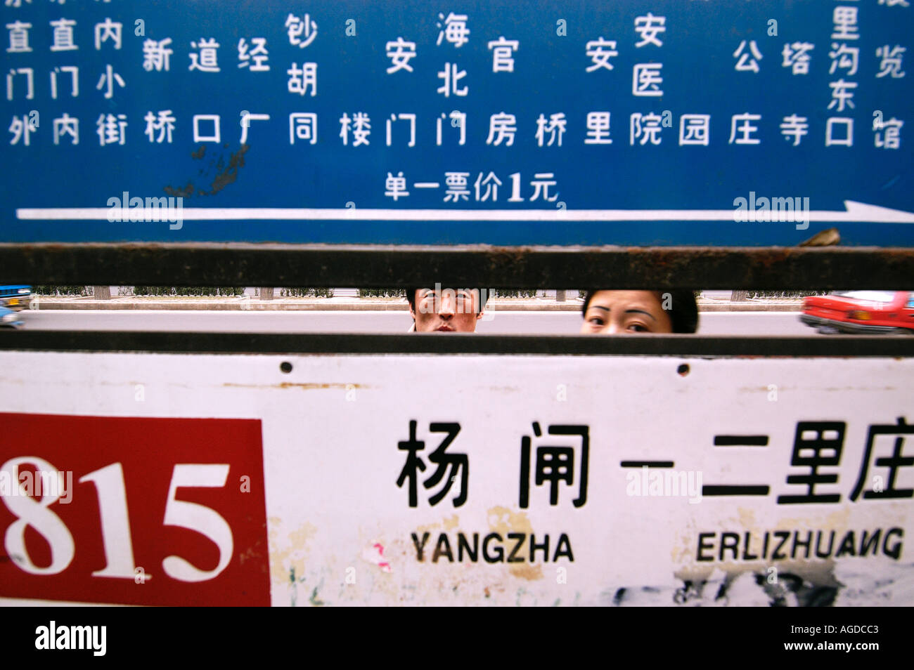 People study a bus timetable in Beijing China Stock Photo - Alamy