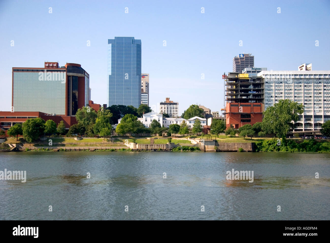 Old Statehouse and modern office buildings along the Arkansas River at ...
