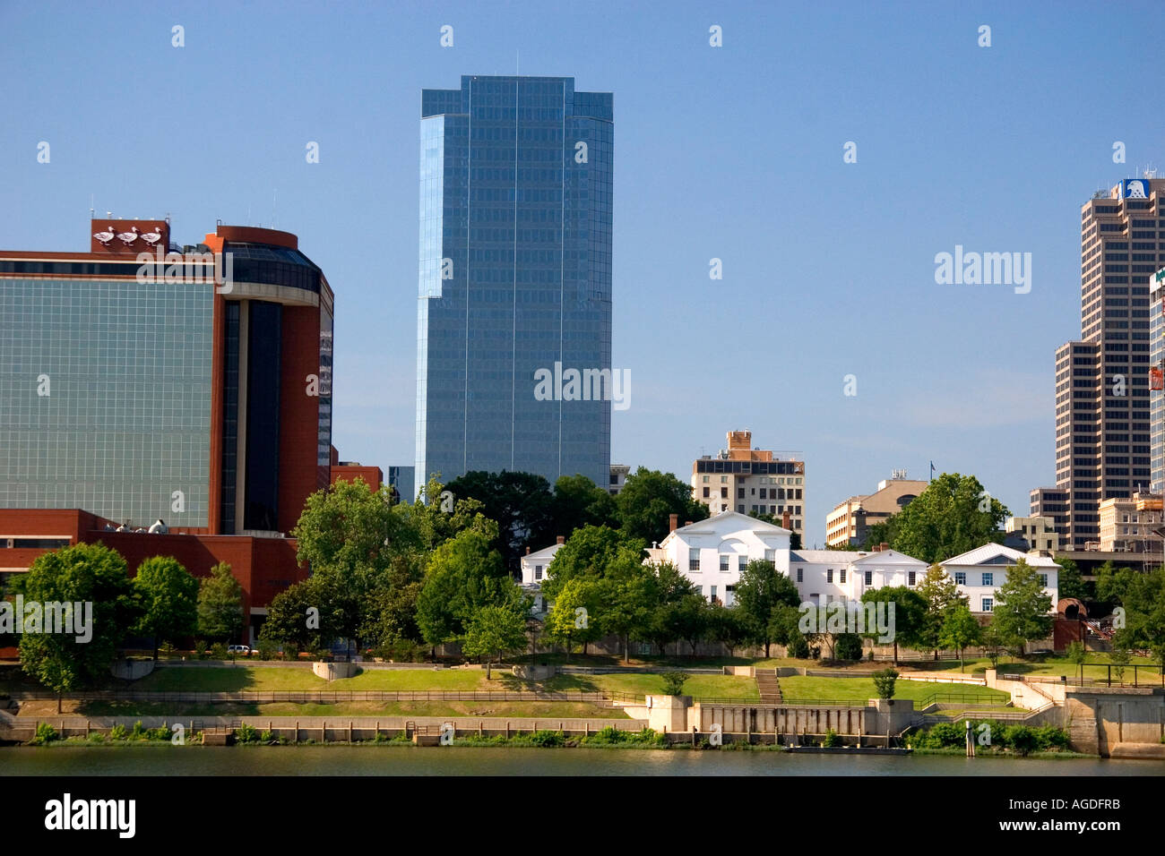 Old Statehouse and modern office buildings along the Arkansas River at ...
