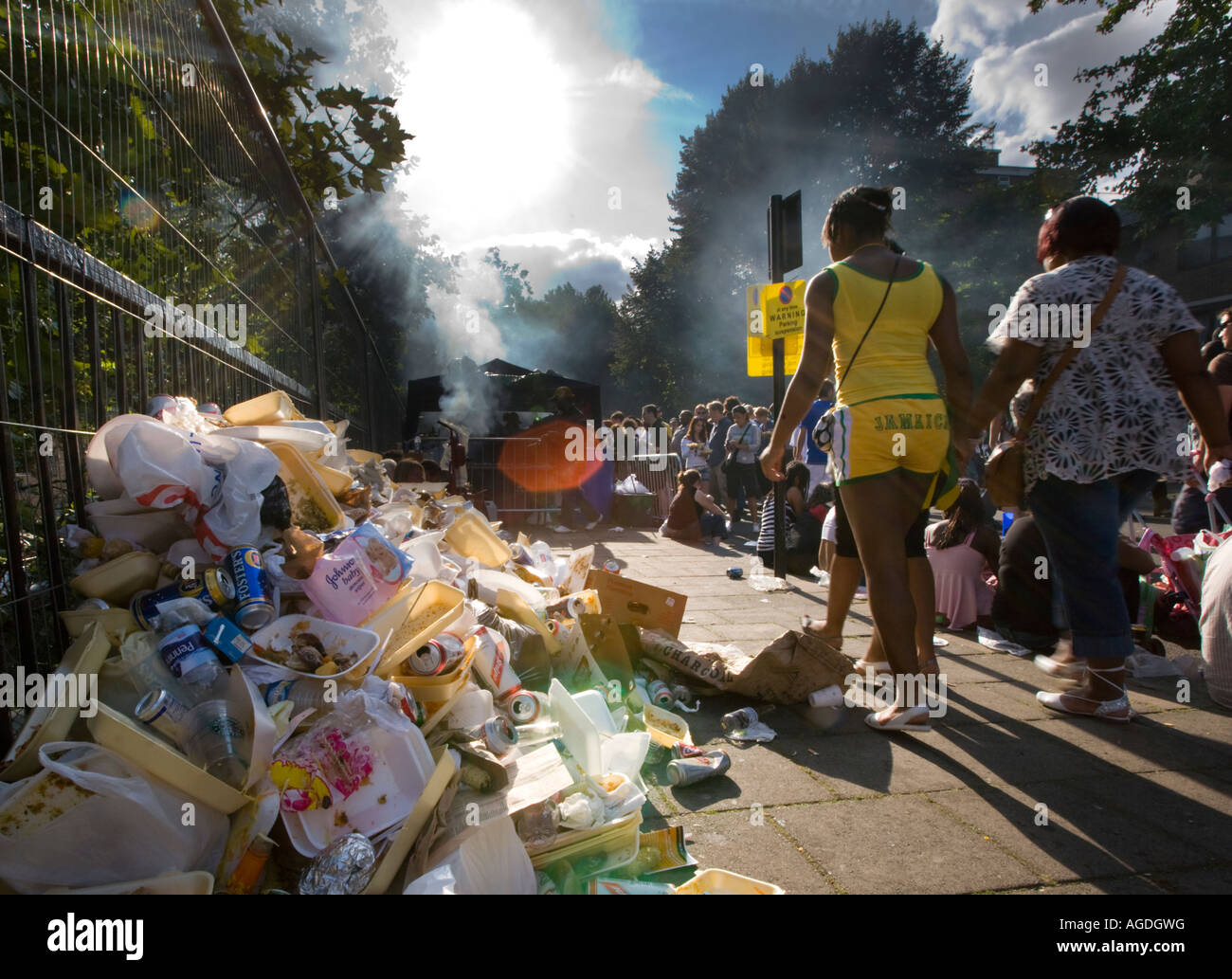 Two women walking past a pile of litter at the Notting Hill Carnival ...