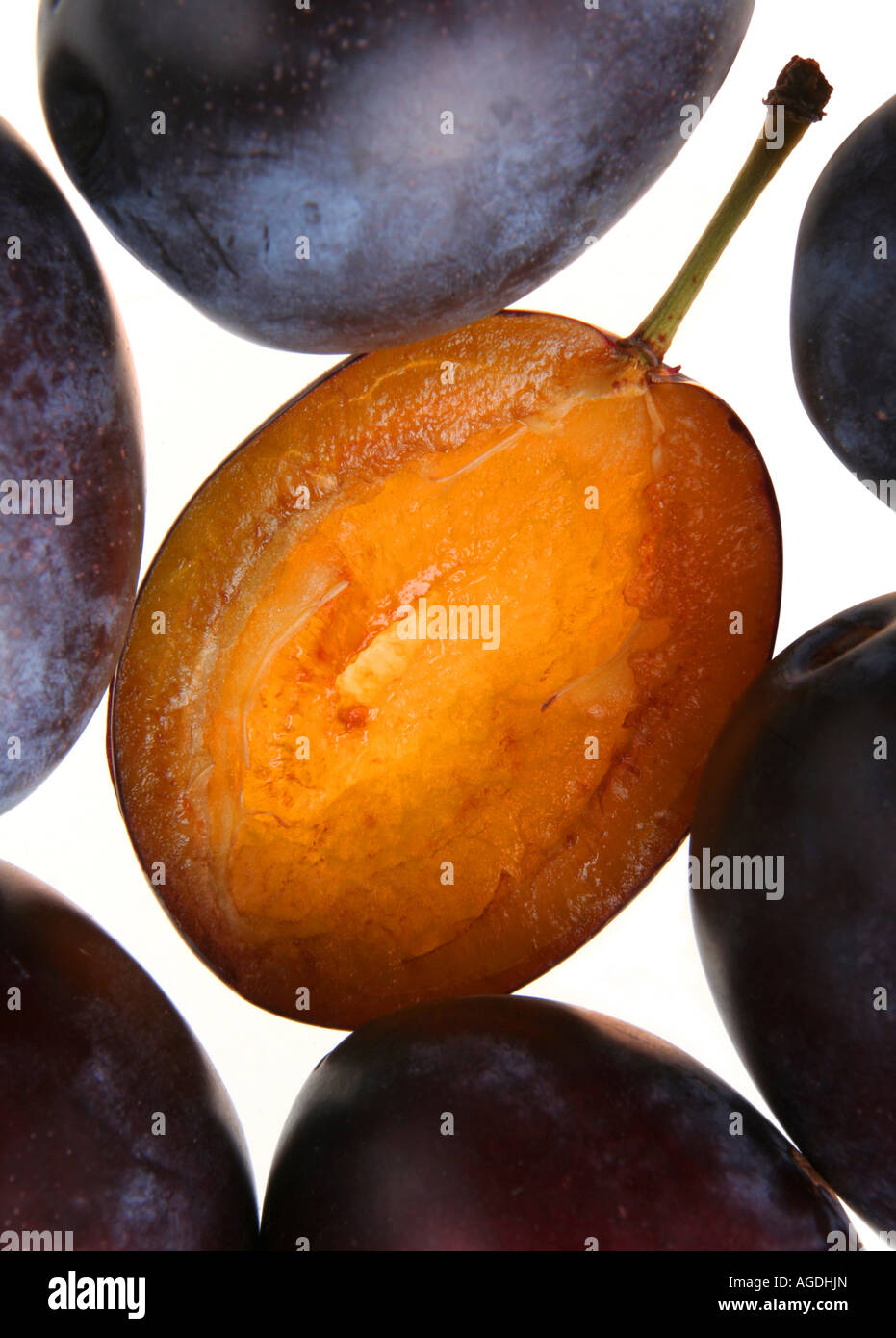Closeup slice plum with plum on white background Stock Photo - Alamy
