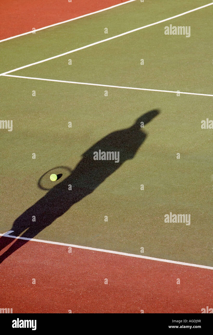 Tennis player's shadow Stock Photo - Alamy