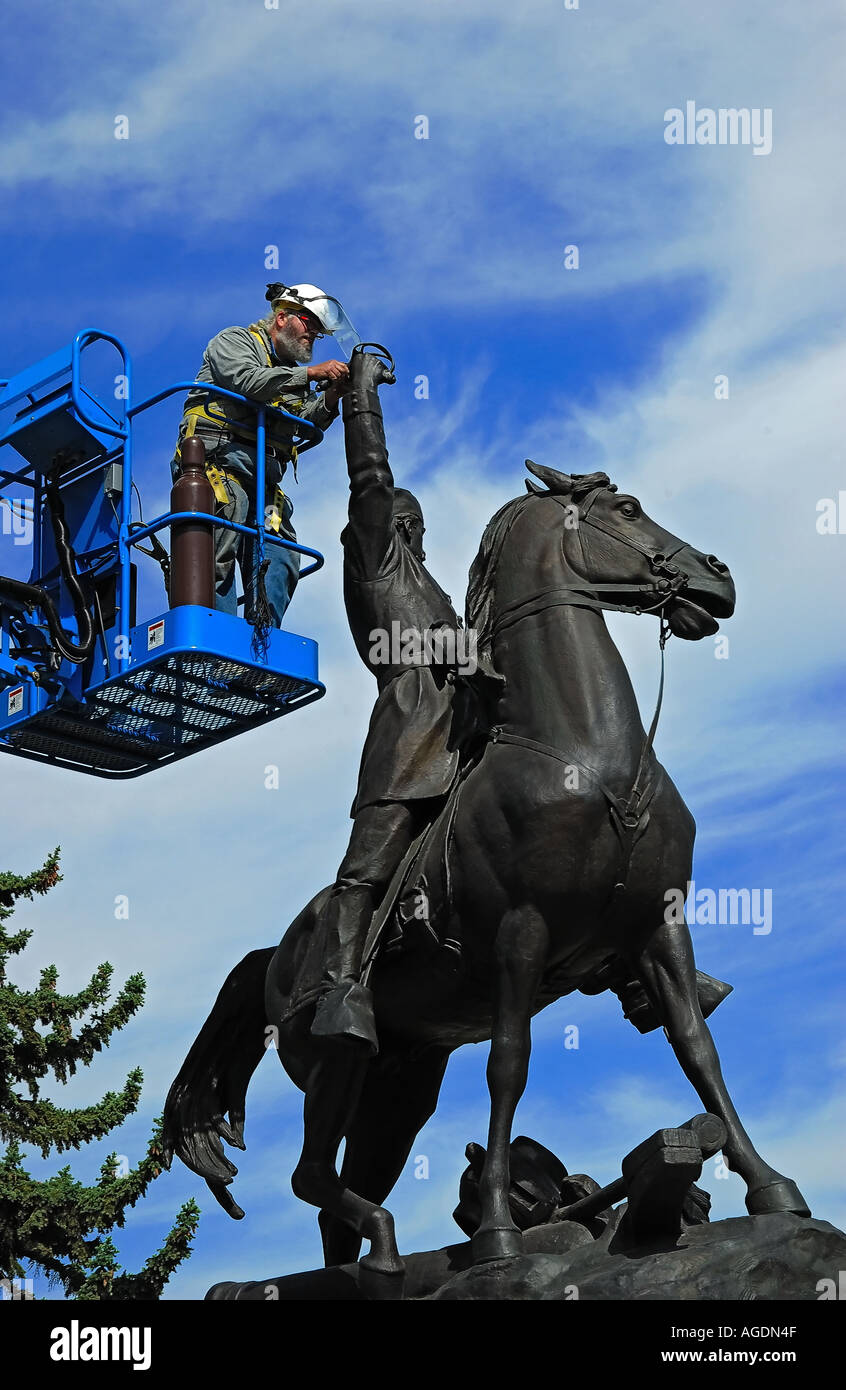 Repairing a statue standing outside the State Capitol of Montana at ...