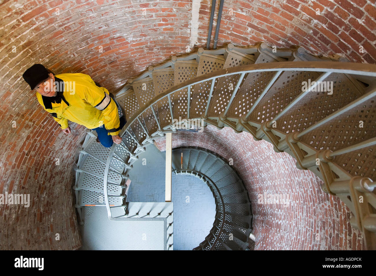 Man descends circular stairway inside Cape Blanco light house Oregon ...