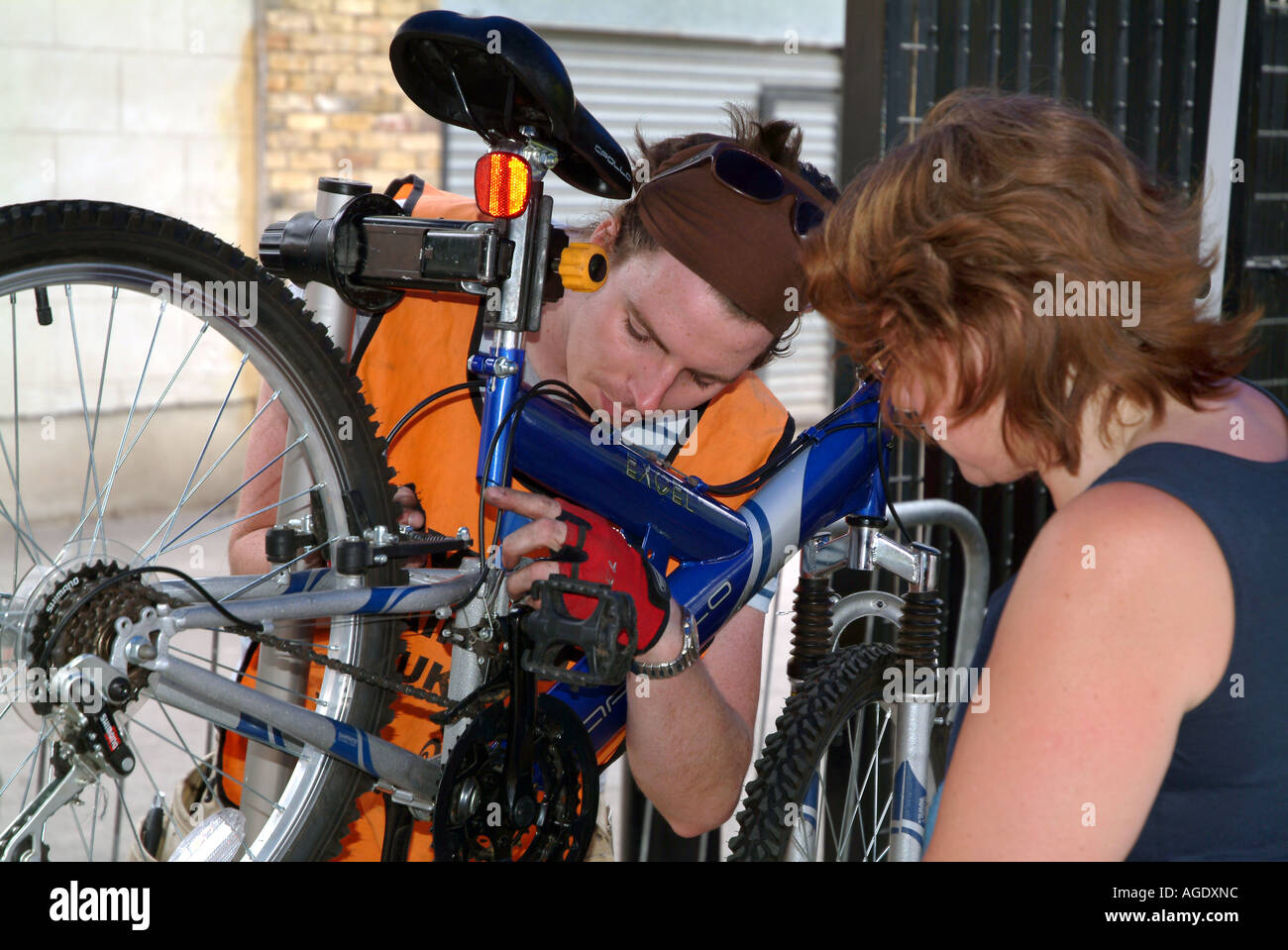 MAN FIXING THE BIKE Stock Photo - Alamy