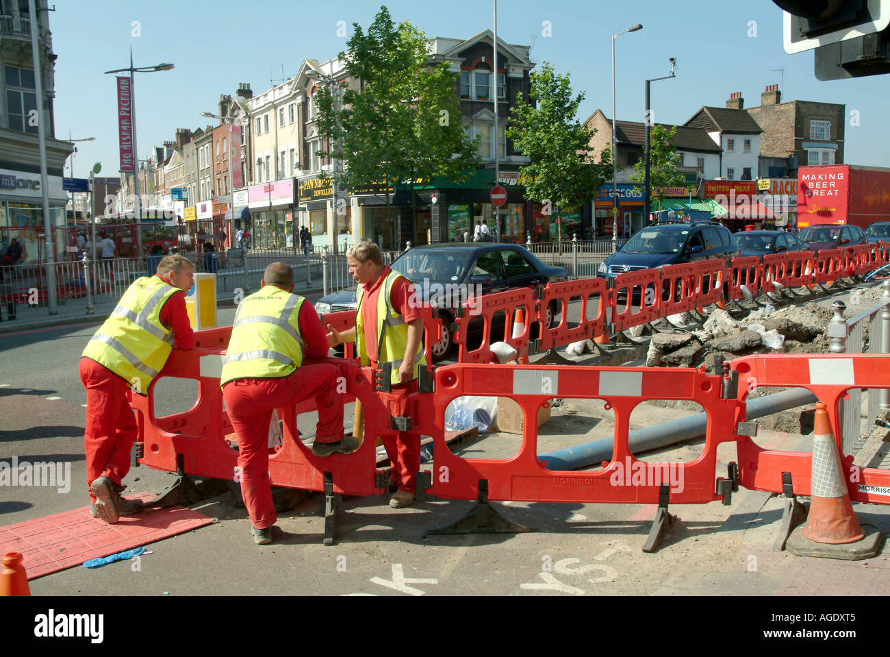 WORKERS CHATTING BY THE ROAD CONSTRUCTION SITE Stock Photo - Alamy