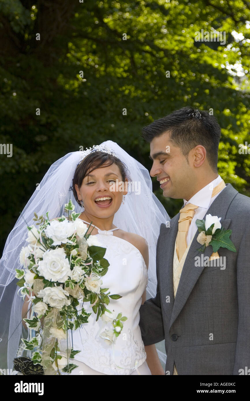 Mexican bride and Kirdish groom laughing at their wedding Stock Photo ...