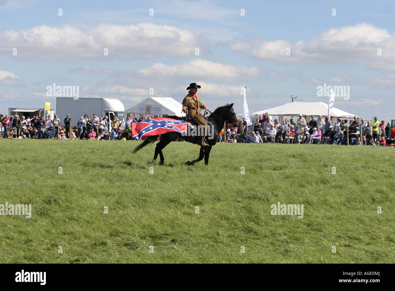 Horseman with American flag performing a wild west show at the ...