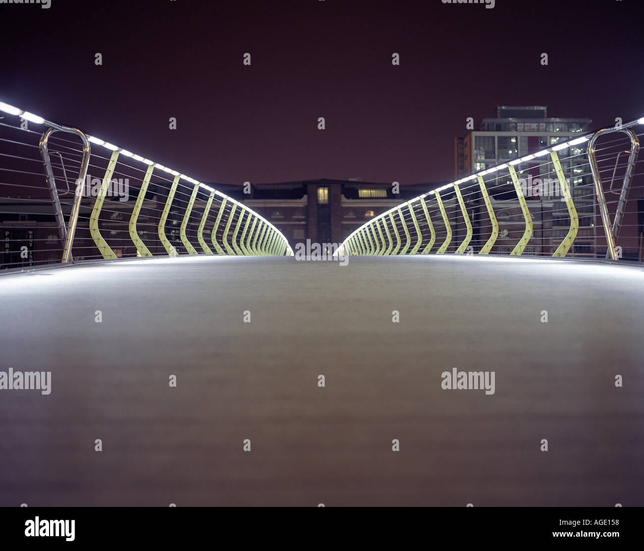 Illuminated footbridge in Docklands at night London England Stock Photo ...