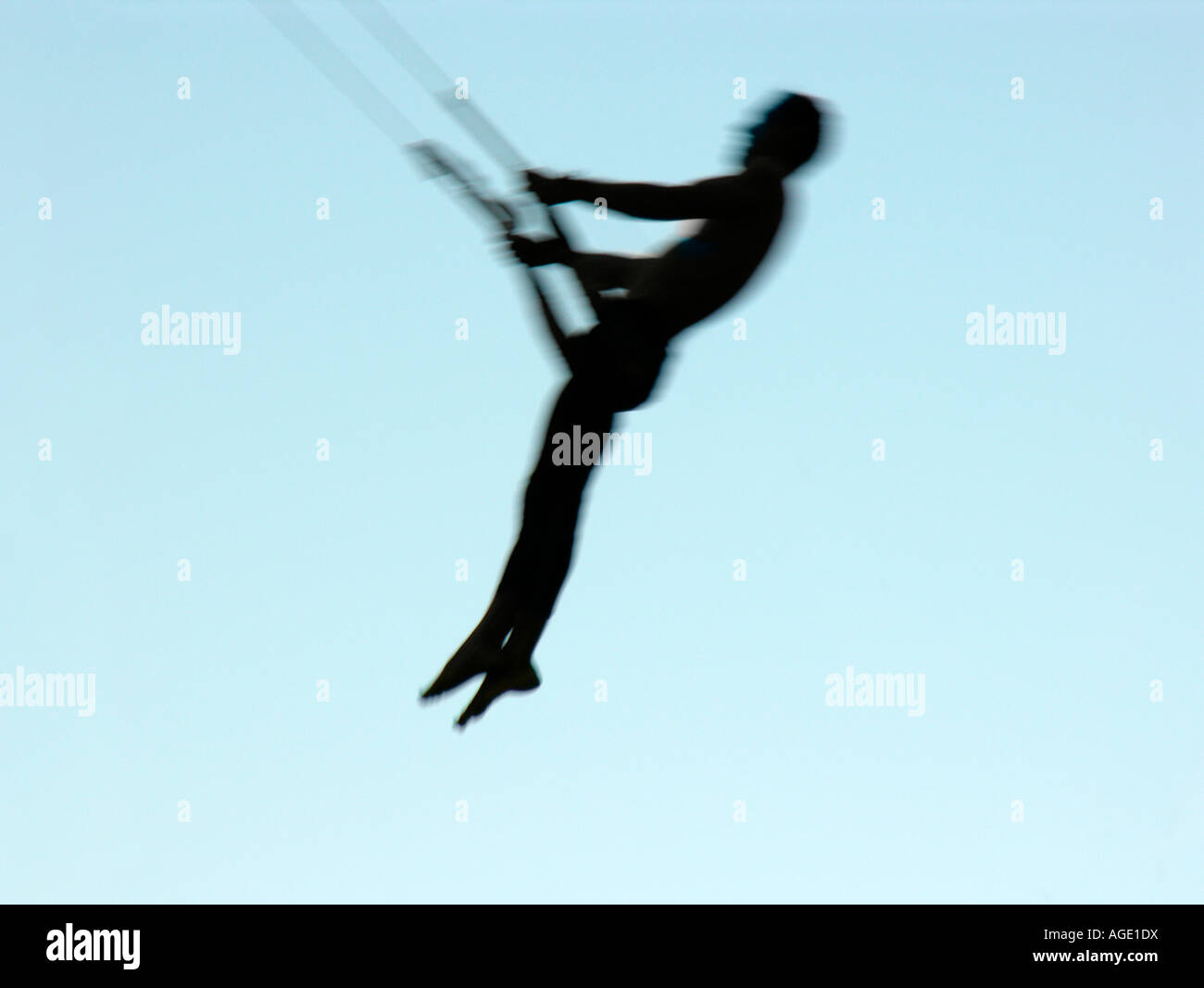 Circus gymnast on trapeze swing Stock Photo - Alamy