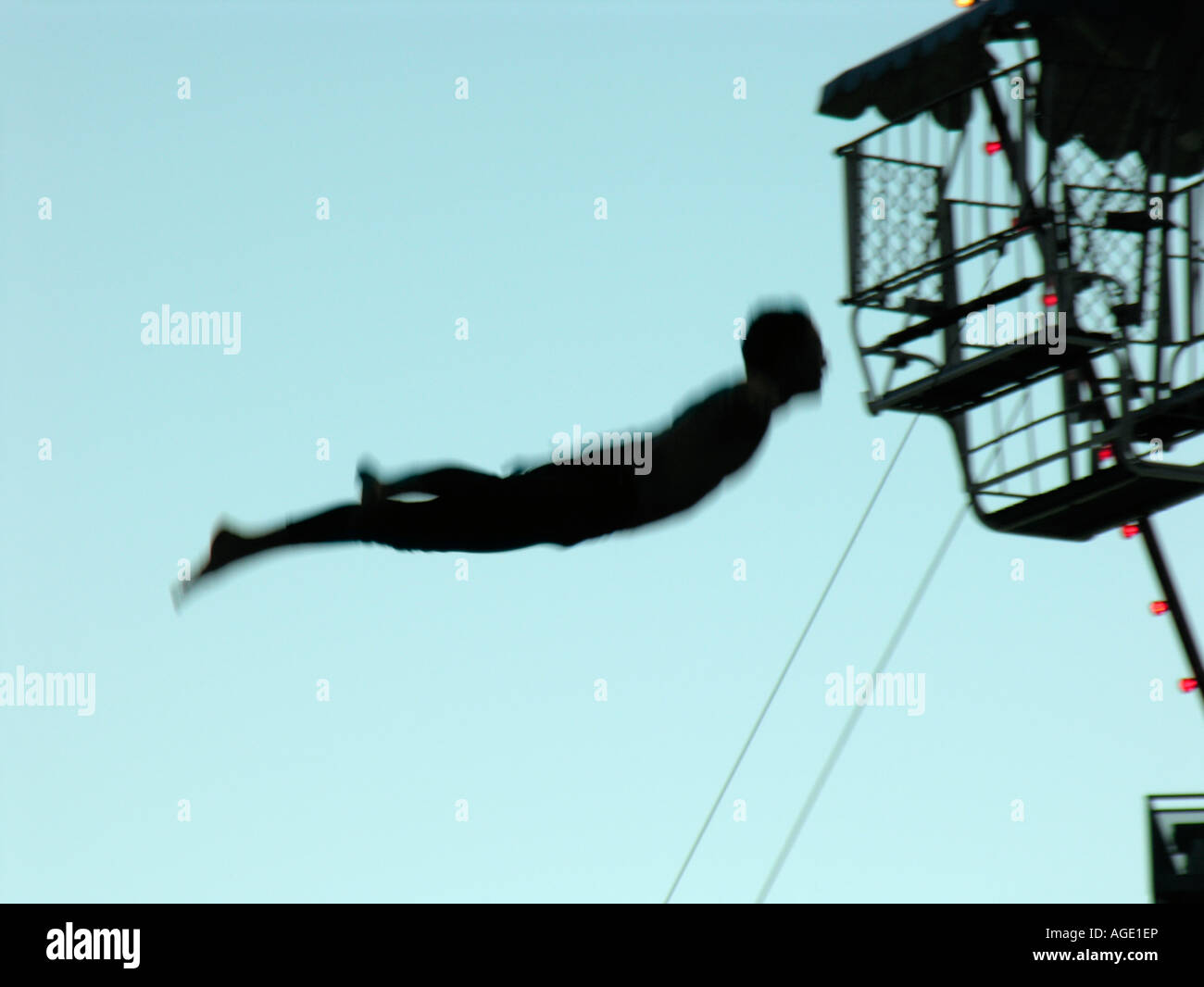 Circus gymnast falling from trapeze Stock Photo - Alamy