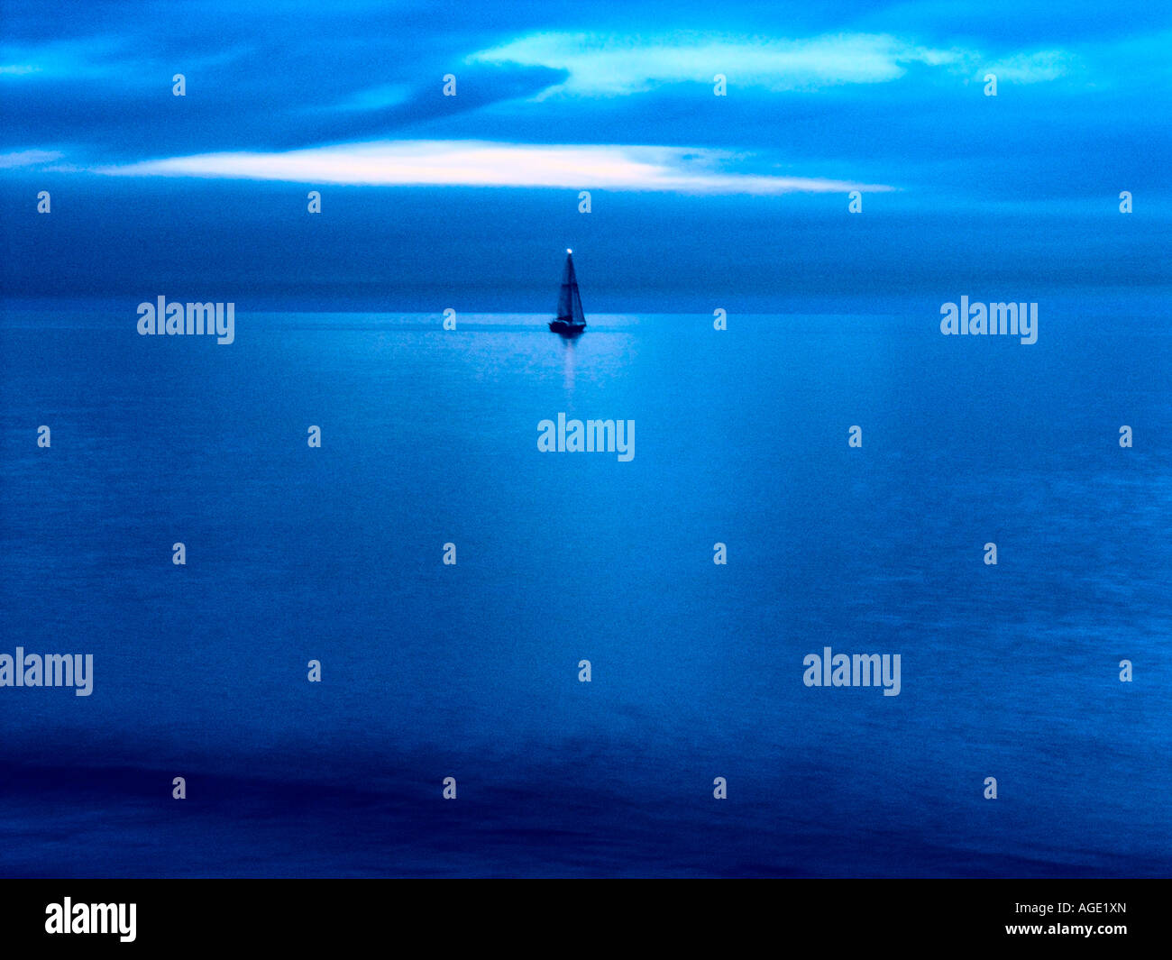 Sailboat sailing at night Stock Photo - Alamy