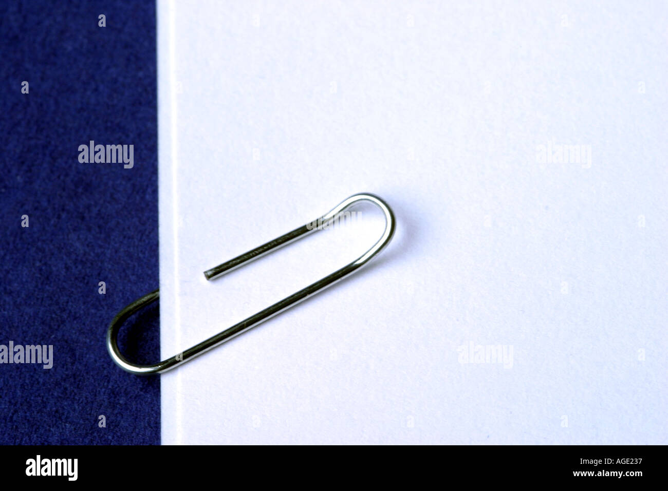 Paperclip holding paper together hi-res stock photography and images ...