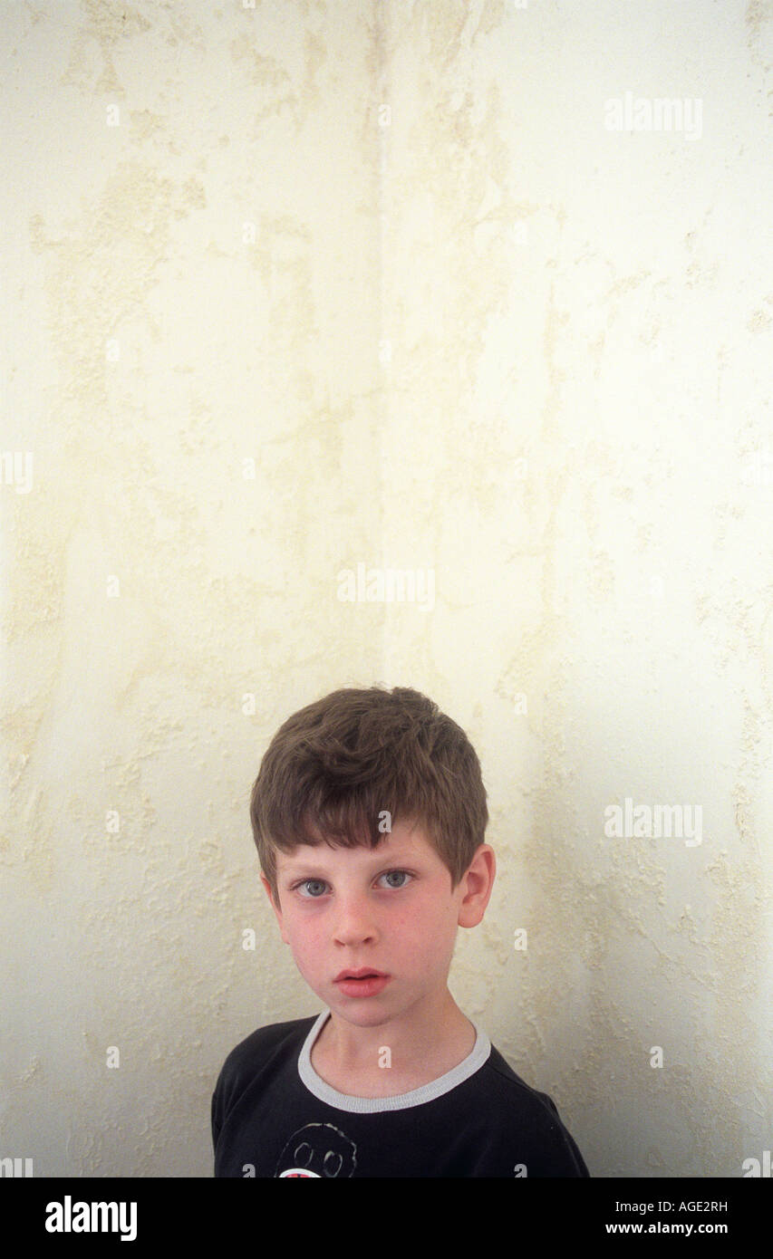 Boy standing in corner hi-res stock photography and images - Alamy