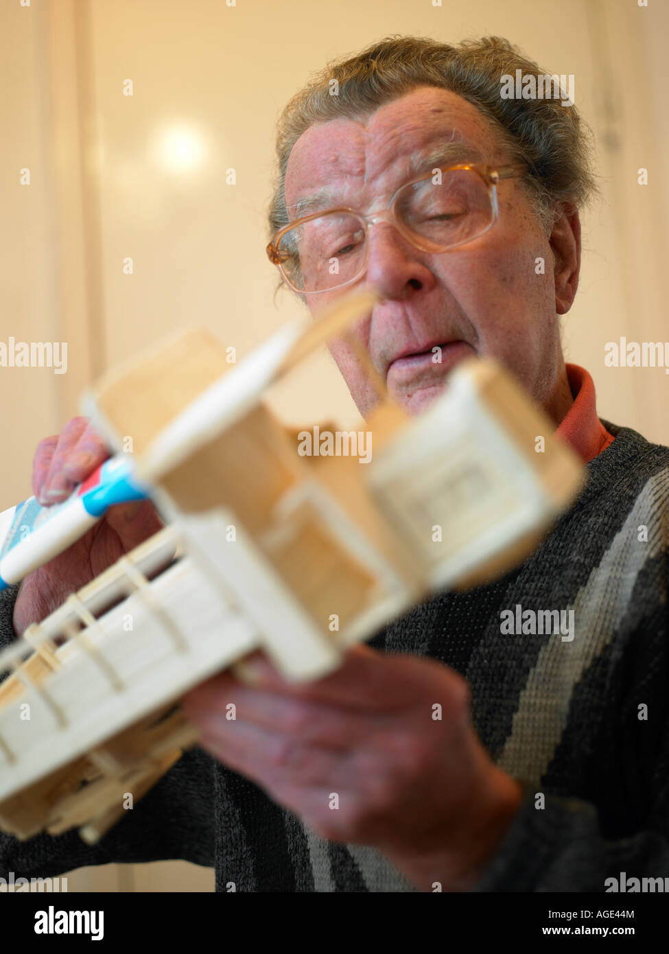 old man working on hobby of modeling Stock Photo - Alamy
