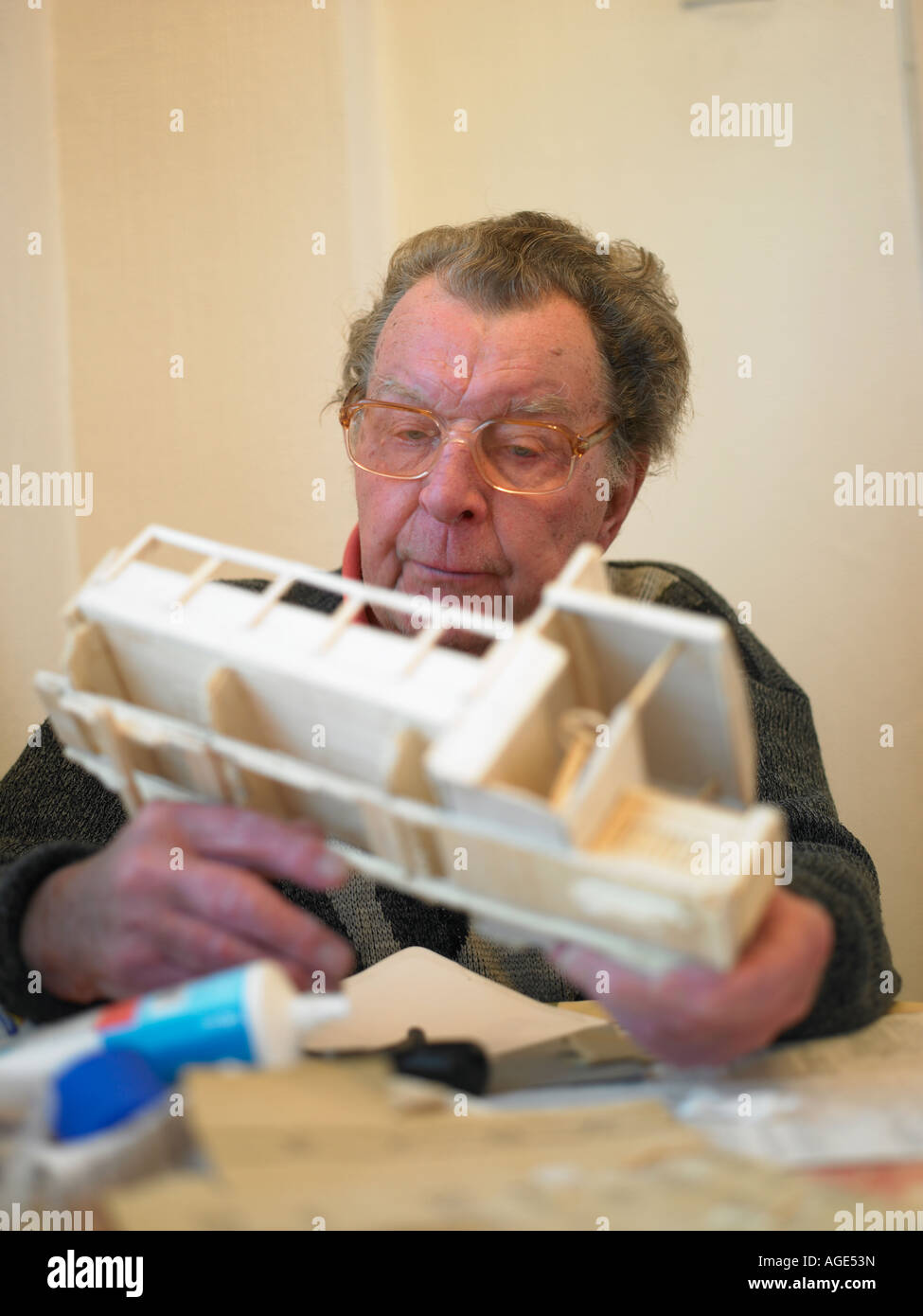 old man working on hobby of modeling Stock Photo - Alamy