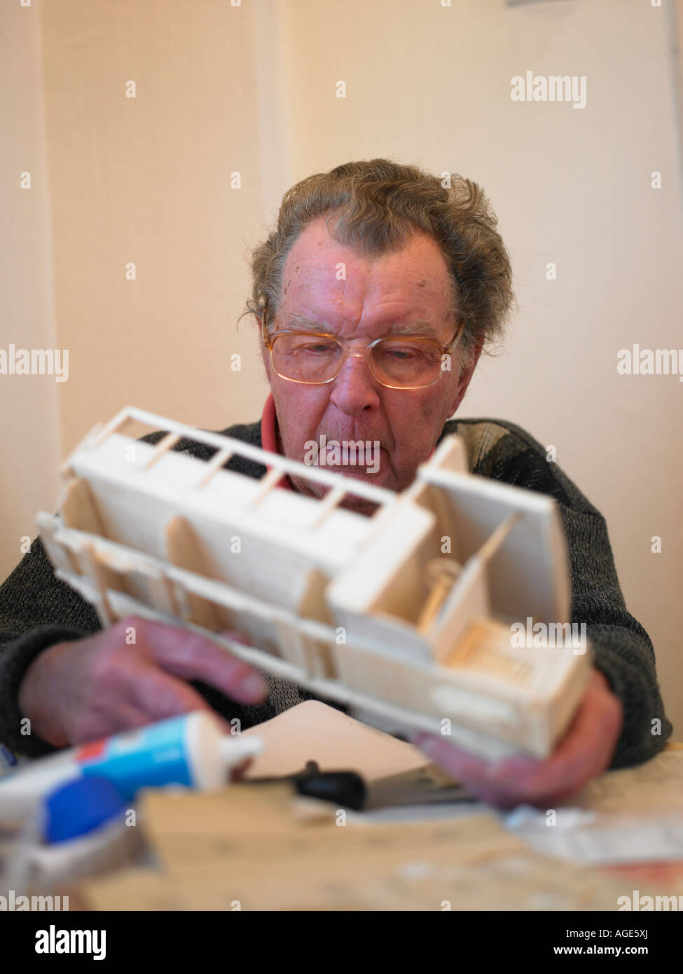old man working on hobby of modeling Stock Photo - Alamy