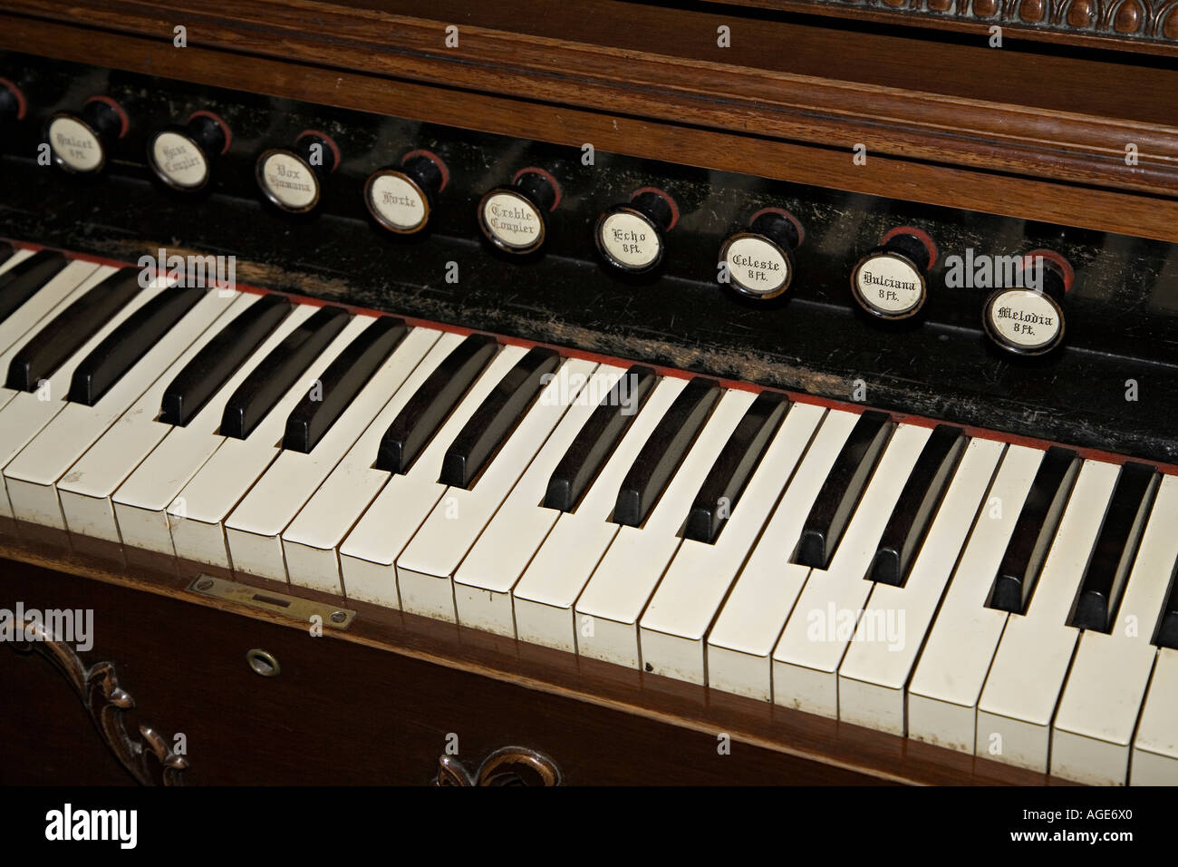 Worn antique organ keyboard with stops Stock Photo - Alamy