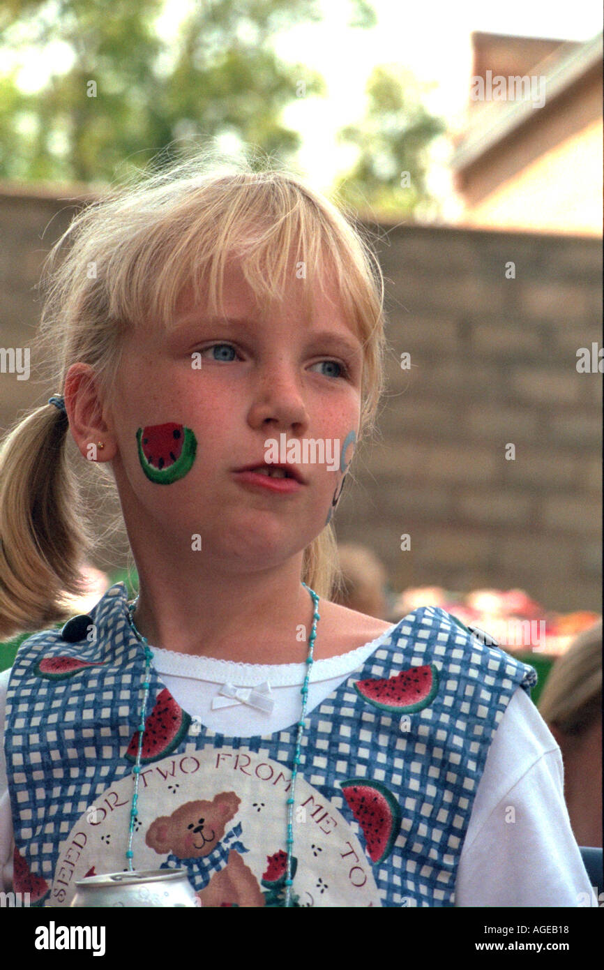 Girl age 9 with melon face painting at Bastille Day Festival ...