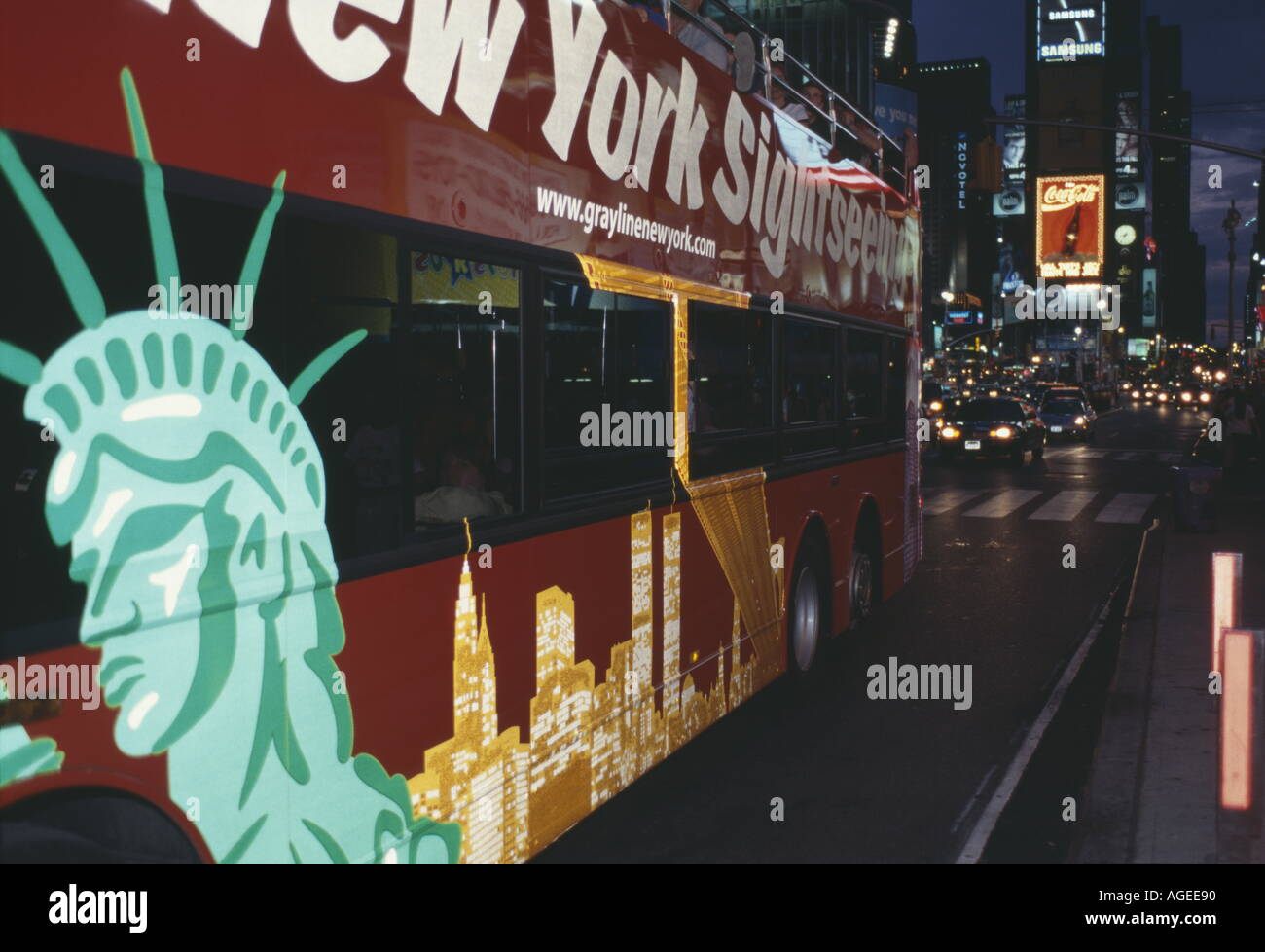 Sightseeing bus in Times Square at night New York USA Stock Photo - Alamy