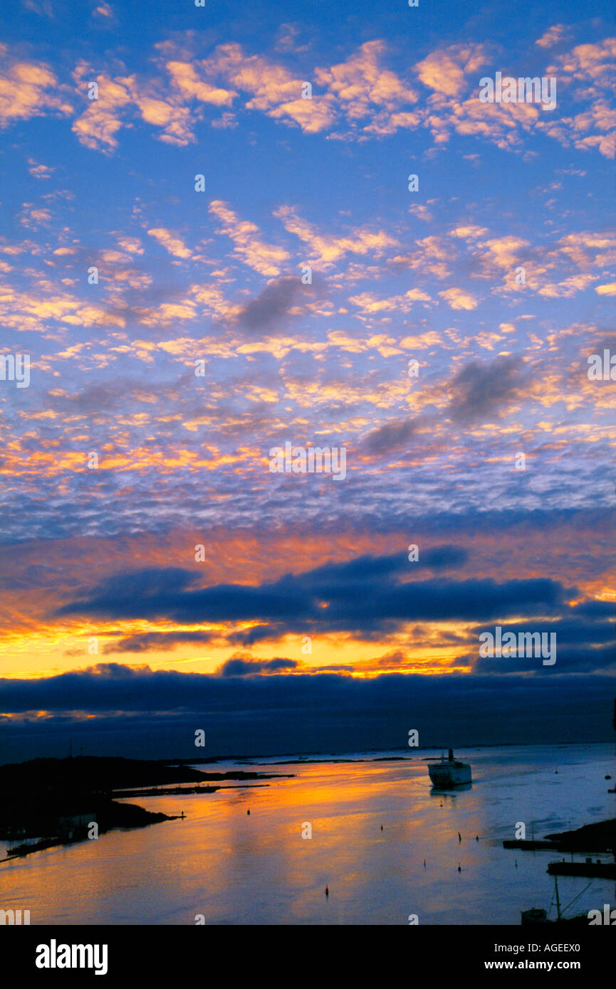 Nightfall over Göta River estuary and a boat sailing in to Gothenburg ...