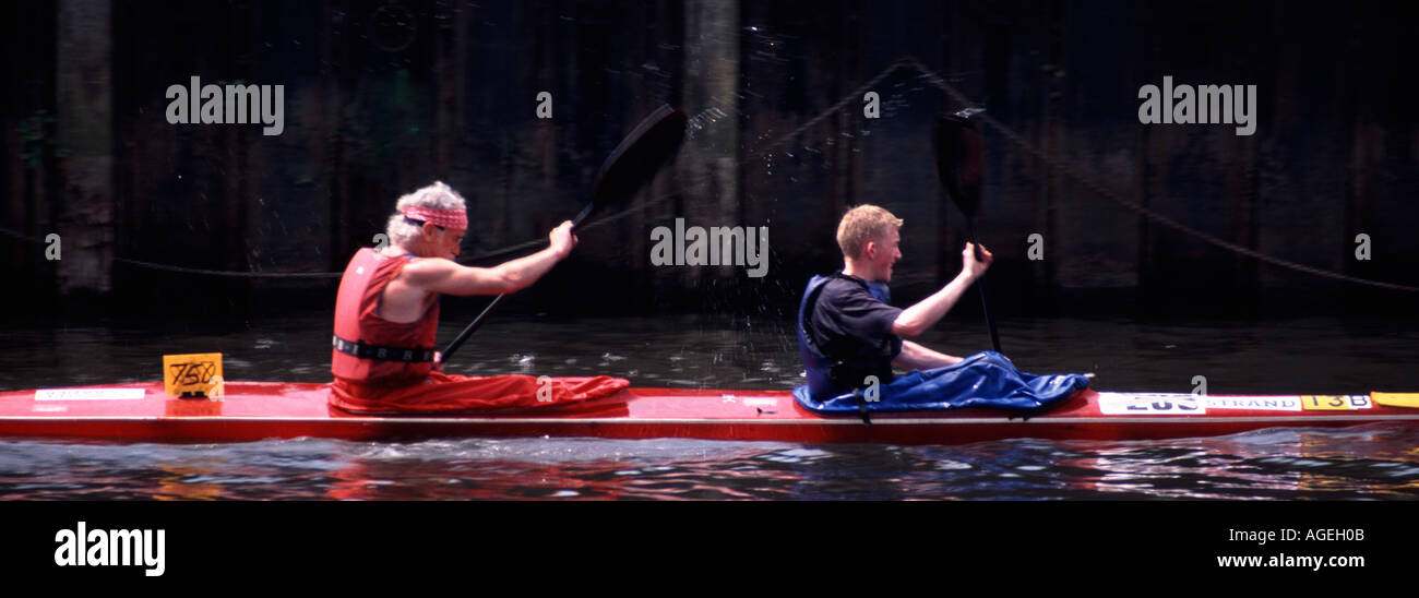 2 men rowing a canoe in competition Stock Photo - Alamy