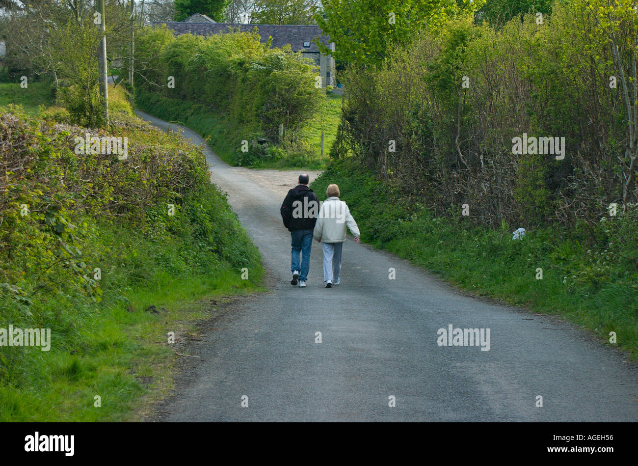 Man walking down country lane hi-res stock photography and images - Alamy