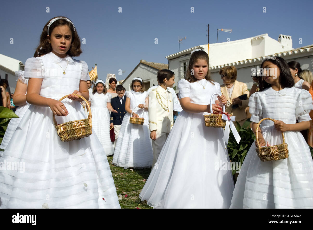 Children in first communion dresses in Corpus Christi procession ...
