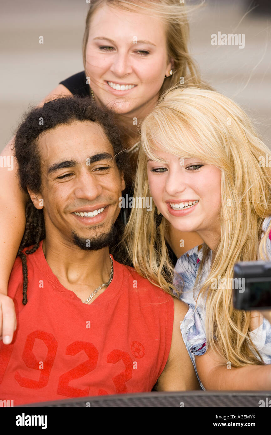 Taking a self-portrait of 3 friends Stock Photo - Alamy