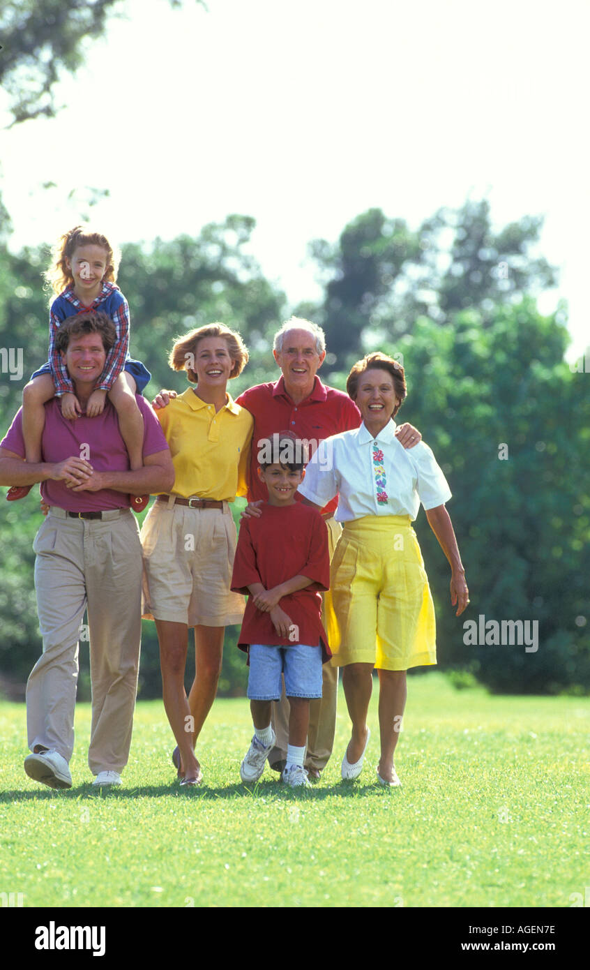 three generation family walking in park Stock Photo - Alamy