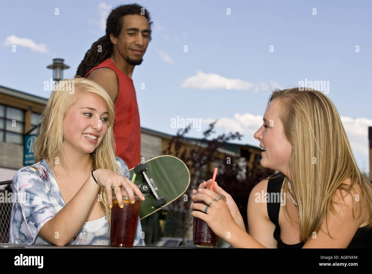 Man noticing two girls at the mall Stock Photo - Alamy
