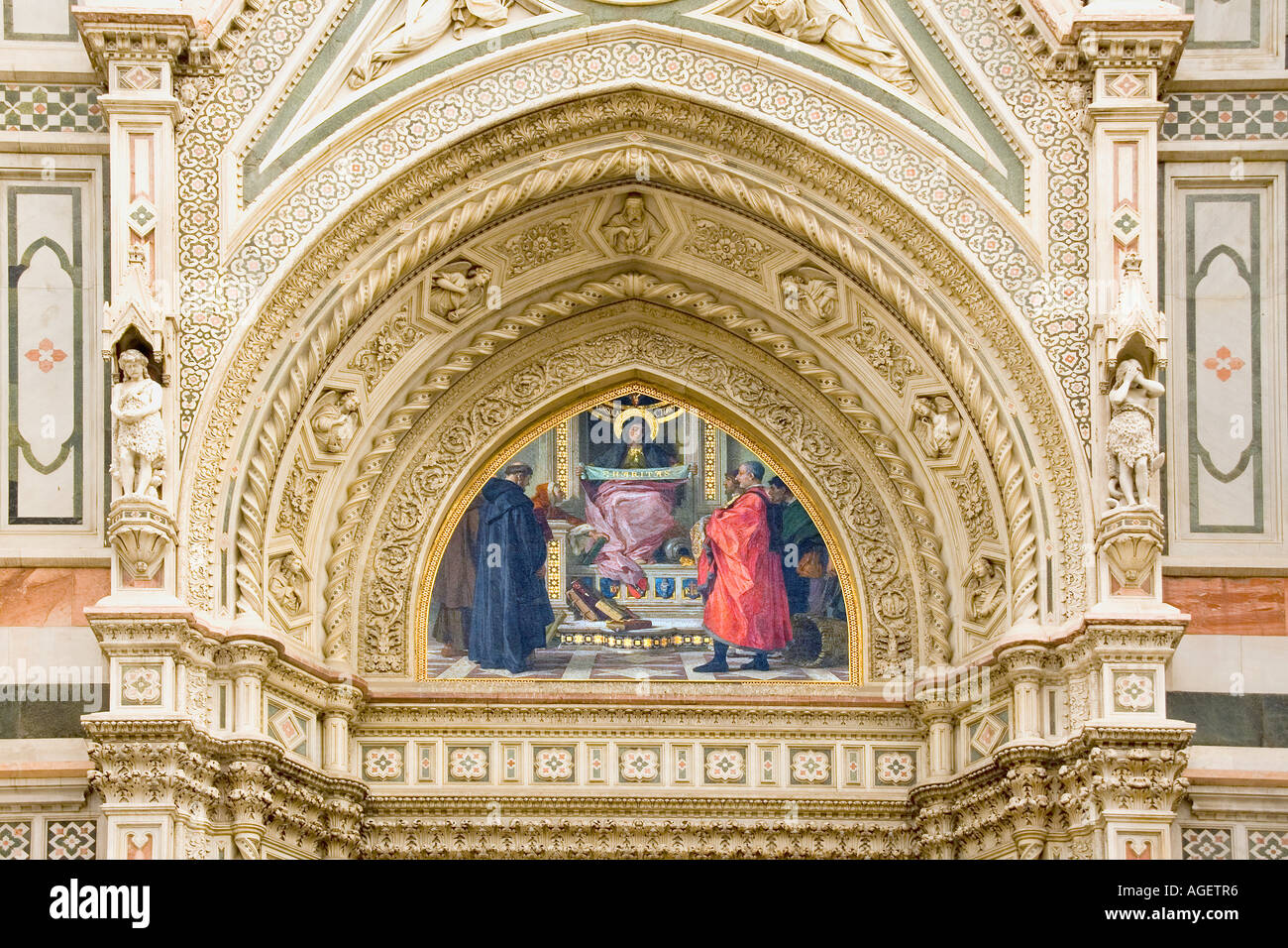 Colourful fresco paintings and intricate stone carvings above the ...