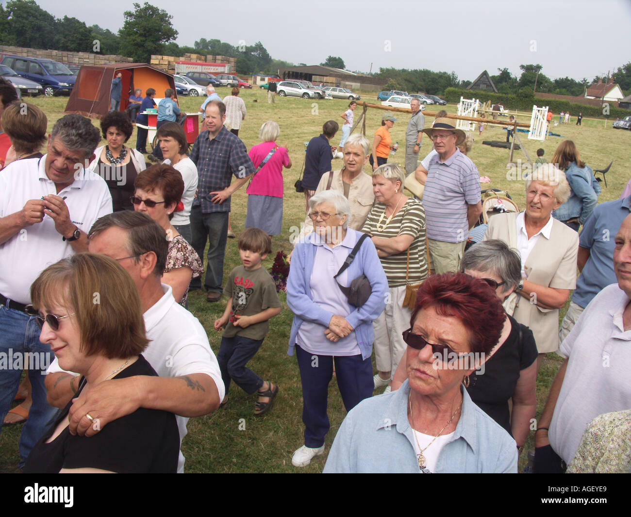 Crowd of people bidding at auction Butley Flower Show Suffolk England ...